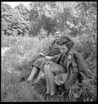 Features. Massey, Rutherford [Two CASC women sitting in grass. Comite ...
