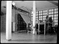 Sunila Pulp Mill. End of the belt [Conveyor belt and workers] — Calisphere