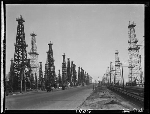 Oil well drilling rigs along Pacific Coast Highway, Huntington Beach ...
