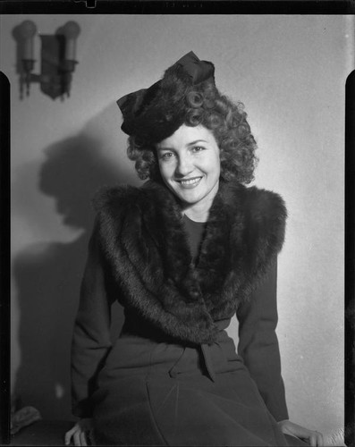 Sue Ackerman Monkman in coat and hat, 1945 — Calisphere