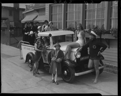 Swimmer Helene Madison with Santa Monica lifeguard, truck, and women at ...