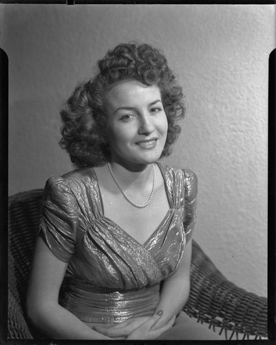 Sue Ackerman Monkman in gown, seated, 1945 — Calisphere