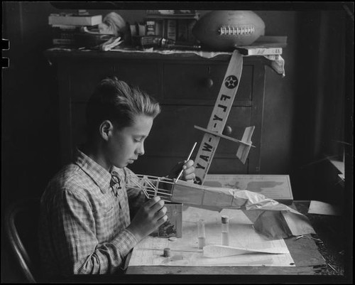 Boy making model airplane, Los Angeles, circa 1935 — Calisphere