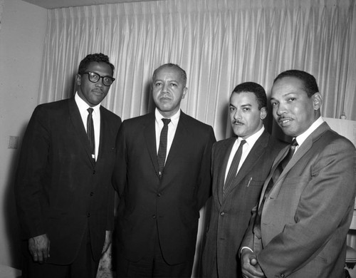 William T. Patrick and Dr. Clarence Littlejohn at a party — Calisphere