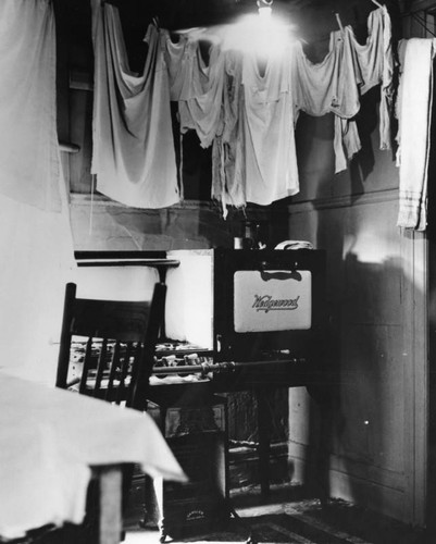Cramped kitchen in a slum apartment — Calisphere