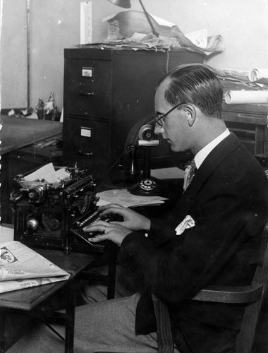 Jack James at his desk — Calisphere