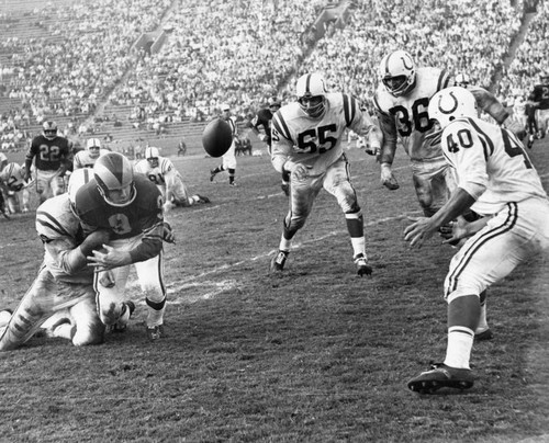 Rookie Ram quarterback, Ron Miller (9), fumbles ball away in final ...