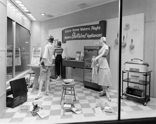 Window display advertising the use of electricity — Calisphere