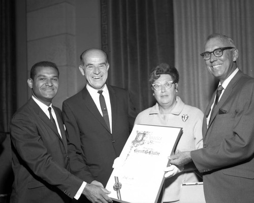 Billy Mills presents resolution to Dr. Everett B. Chaffee — Calisphere