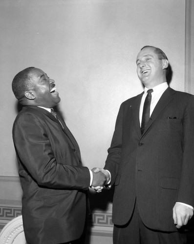 Congressional District Representative Thomas Rees shakes hand with ...