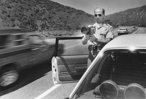 CHP with radar gun — Calisphere
