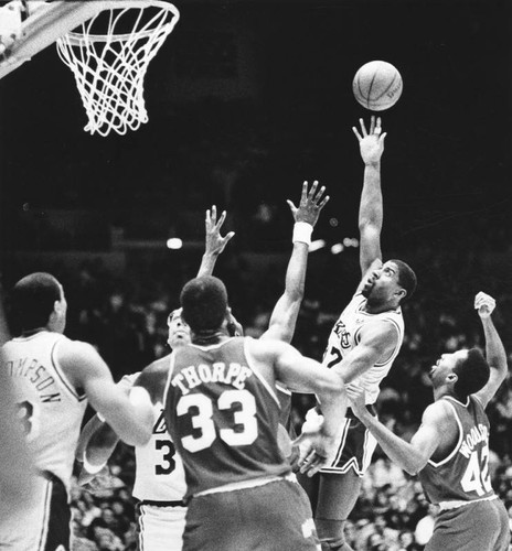 Magic Johnson going for a hook — Calisphere