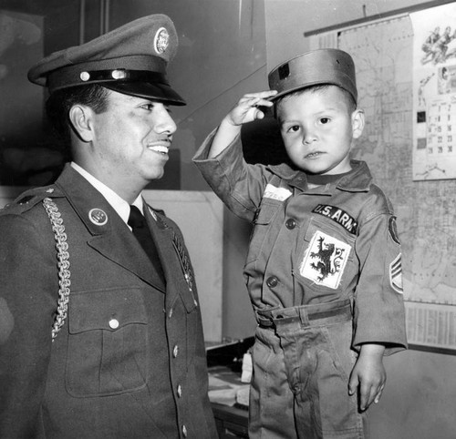 Small soldier snaps smart salute — Calisphere