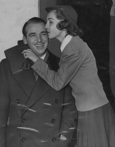UCLA Alpha Chi Omega pledge kisses Douglas Fairbanks Jr — Calisphere