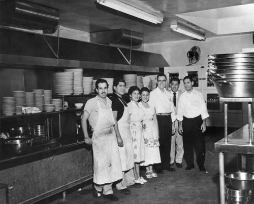 Staff and cooks in the Gonzalez Restaurant kitchen — Calisphere