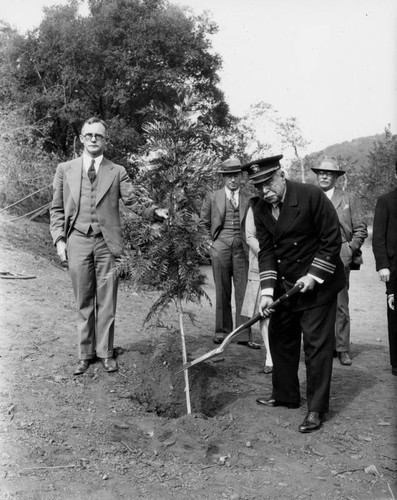 Lt. Commander Souser planting tree — Calisphere