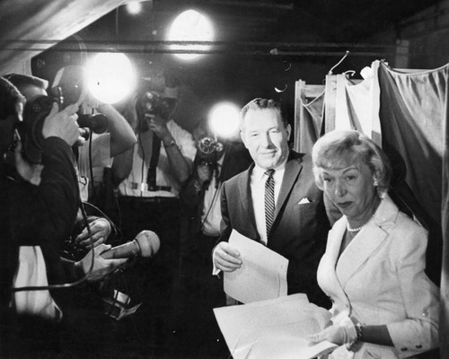 Mayor Samuel W. Yorty and Mrs. Yorty vote in Studio City — Calisphere