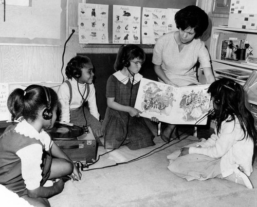 Intern helps children with their reading — Calisphere