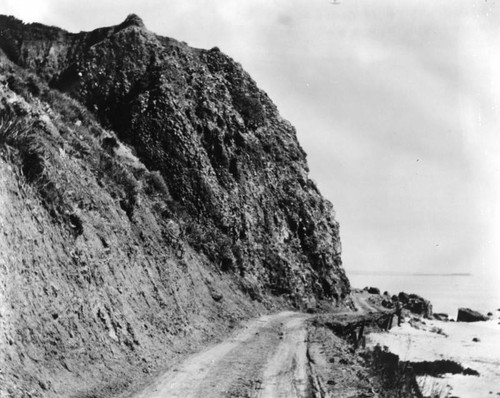 Earth road and cliff by the ocean — Calisphere
