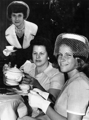 Mrs. John Tuttle, center, will hostess NCL event Saturday — Calisphere