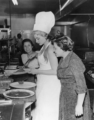 Mexican personality works in kitchen — Calisphere