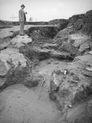 L.A. River flooding, standing by a muddy crevice in Studio City ...