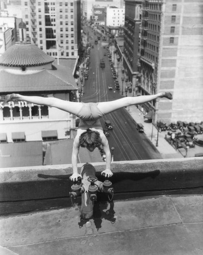 Rooftop female acrobat — Calisphere
