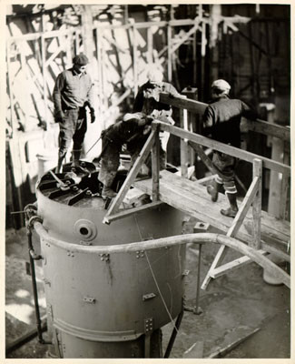 [Workers standing on inspection well inside cofferdam during ...
