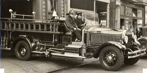 [Firemen driving fire engine at Engine No. 14] — Calisphere