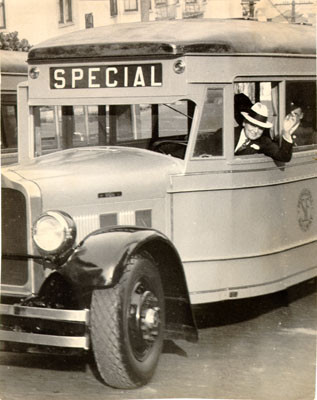 [Mayor Angelo J. Rossi sitting behind the wheel of a new Muni bus ...