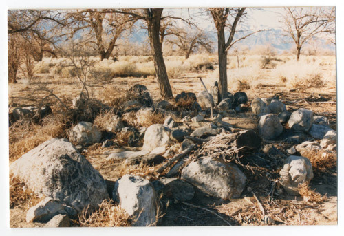 Color photograph of remains of Manzanar, many boulders — Calisphere
