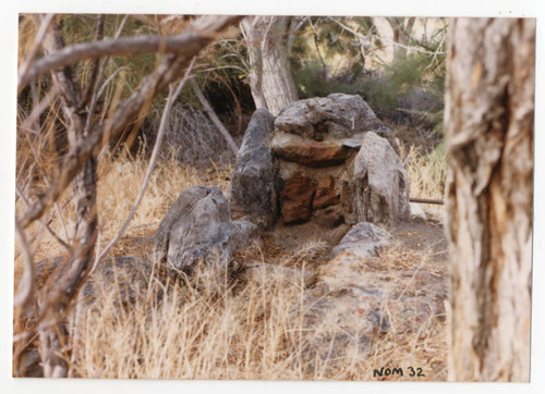 Color photograph of remains of Manzanar, stones — Calisphere