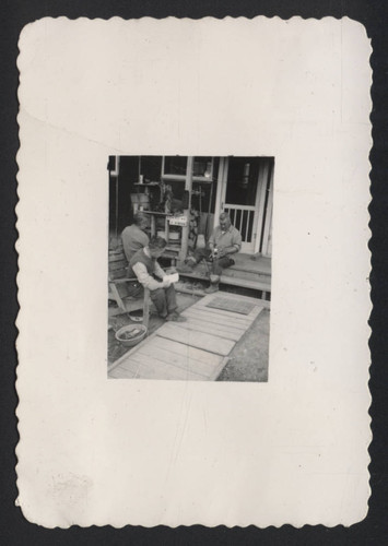 Jerome incarcerees reading a book and woodworking — Calisphere