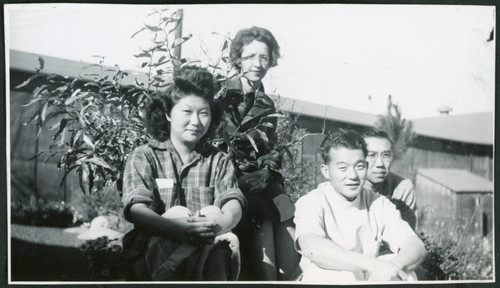Photograph of four people posing in front of the Manzanar hospital ...
