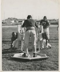 Bob Shaw coaching football players — Calisphere