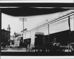 Thomas Bryan driving low dray in front of G.P. McNear Company on B ...