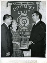 Judge Merrick presenting Honorable Malibuite Award, 1962 — Calisphere