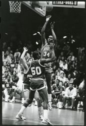 Basketball player Eric White at the net, mid 1980s — Calisphere