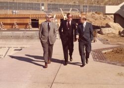 M. Norvel Young and group surveying Runnels Memorial Pool construction ...