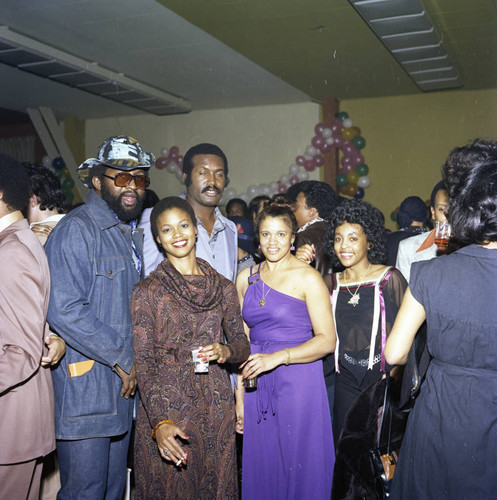 Connie Thompson posing with guests at her Super Bowl party, Los Angeles ...