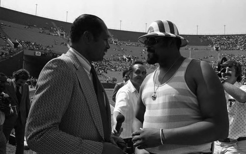 Tom Bradley and Rosey Grier talking together during the Urban League's ...