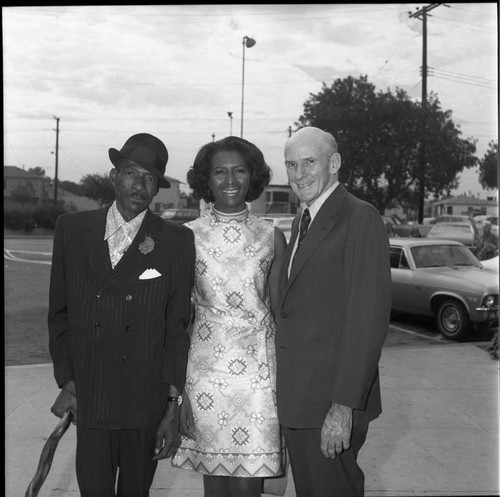 Senator Alan Cranston posing with Mayor Doris Davis and a senior ...