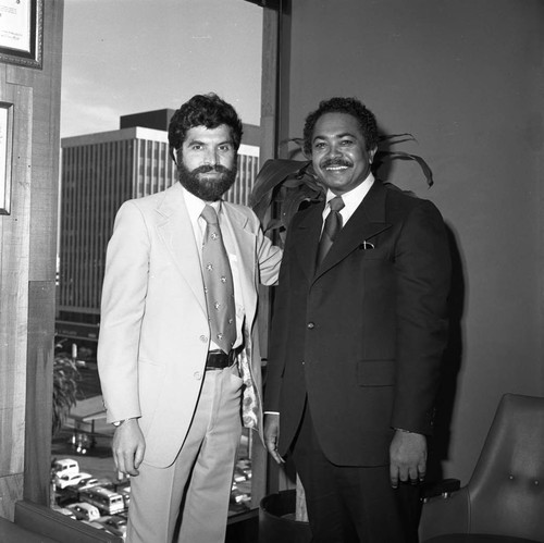 Charles Lloyd posing with Mervyn Dymally, Los Angeles, 1976 — Calisphere