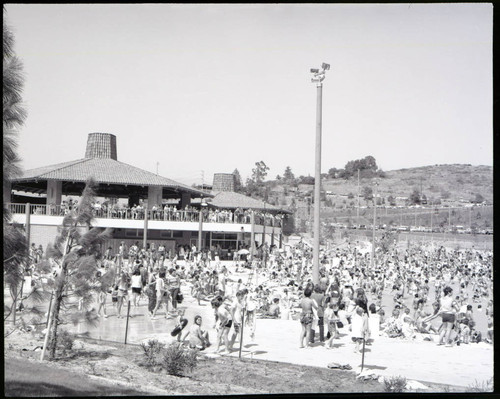 View of swimmers at Frank G. Bonelli Regional Park swim beach — Calisphere