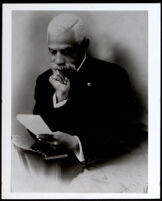 Allen Allensworth reading, circa 1913 — Calisphere