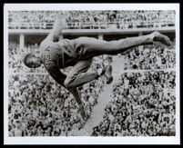 Cornelius Cooper Johnson executing a high jump at the Olympic stadium ...