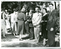 Dr. John A. Somerville at a gathering in a garden, 1950s — Calisphere