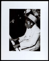 A. C. Bilbrew playing a piano, circa 1963 — Calisphere