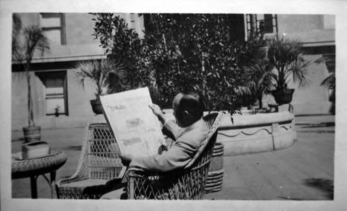 Lung Yep reading Chung Sai Yat Po Auto Ad, taking it easy at the U.S ...