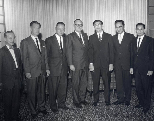 A group of men, from left to right: Poy Wong, Delbert Wong and Albert ...
